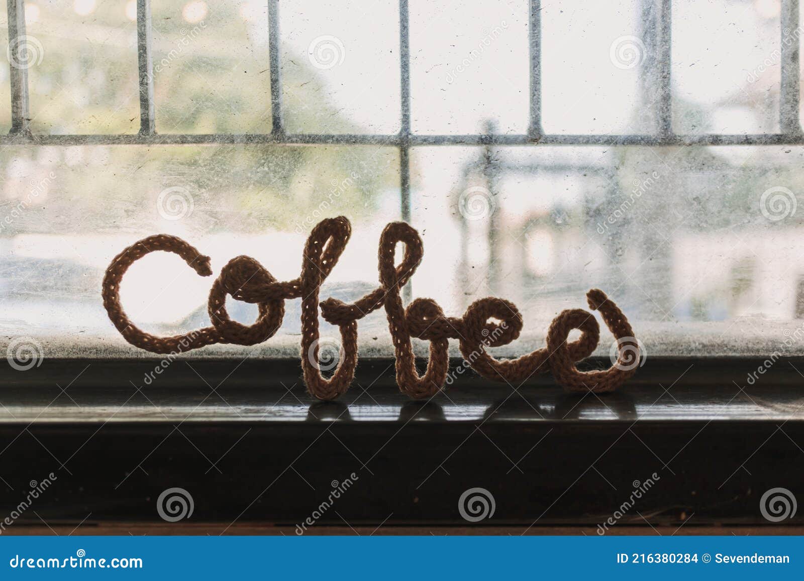 Fancy Wire Shaped into Word COFFEE Stand on the Edge of Window. Stock ...
