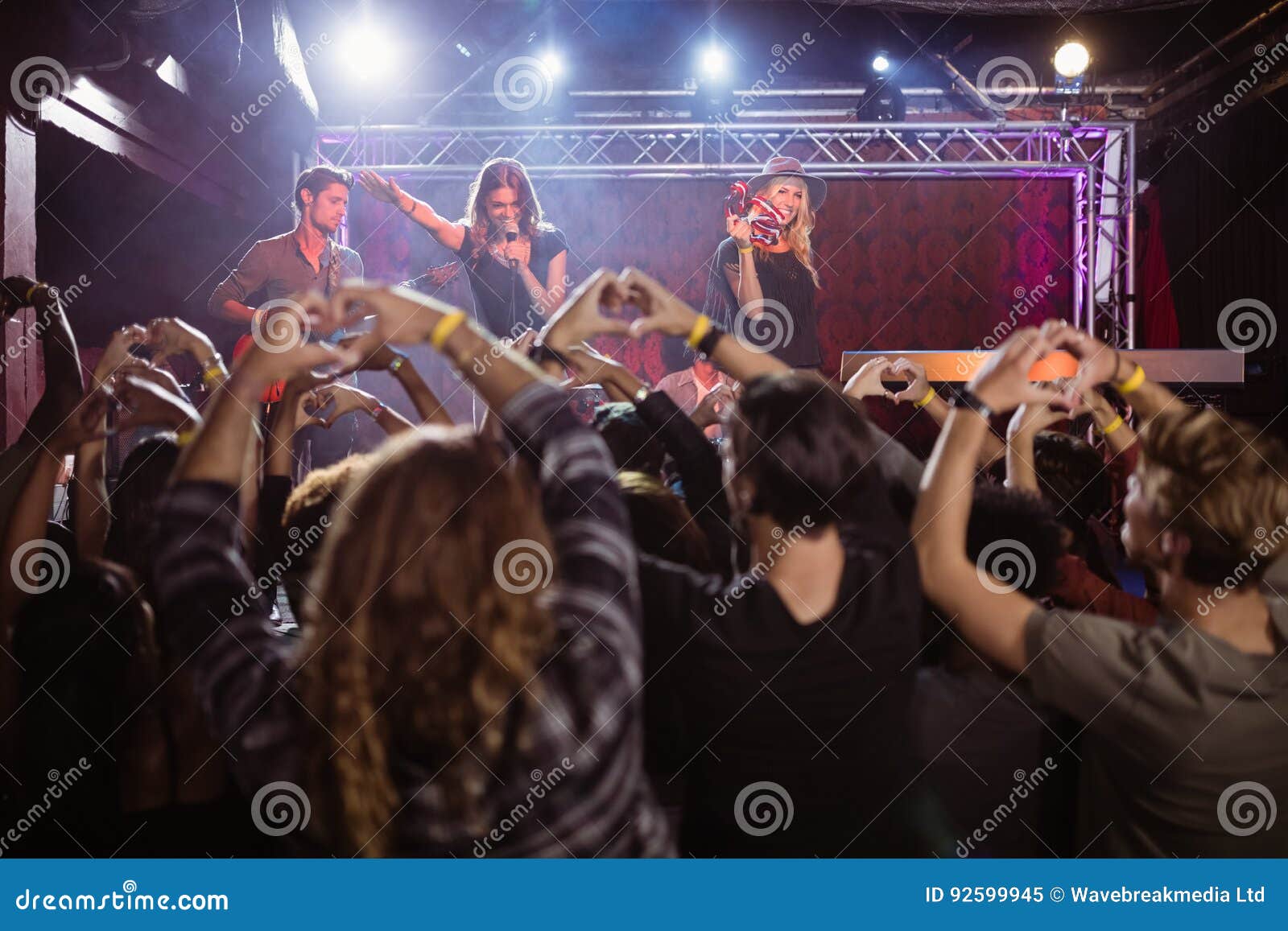 Fans Making Heart Shape with Hands during Performance Stock Image ...