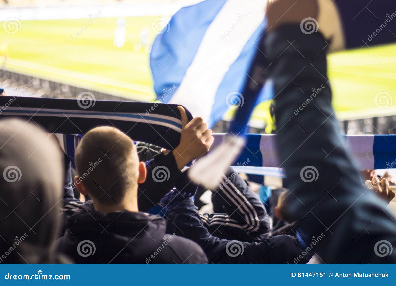 Fans in the Stadium Holding Flags of Their Football Team Editorial ...