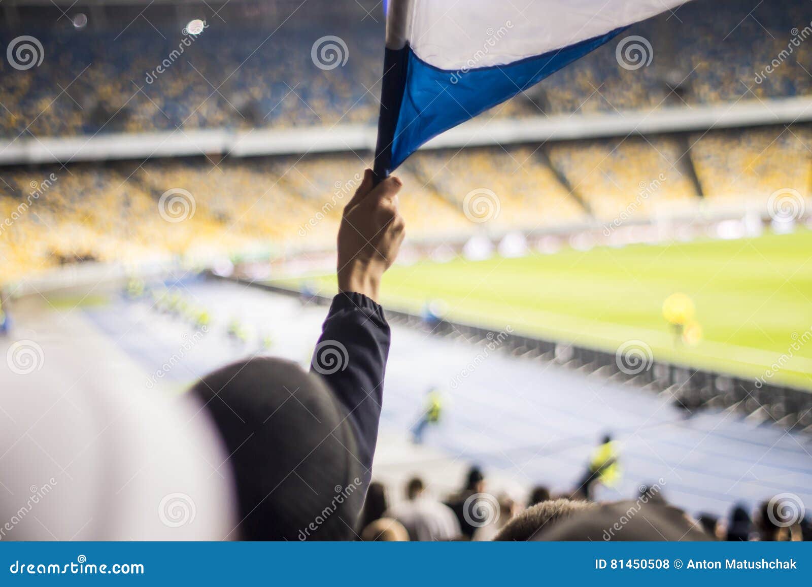 Fans in the Stadium Holding Flags of Their Football Team Editorial ...