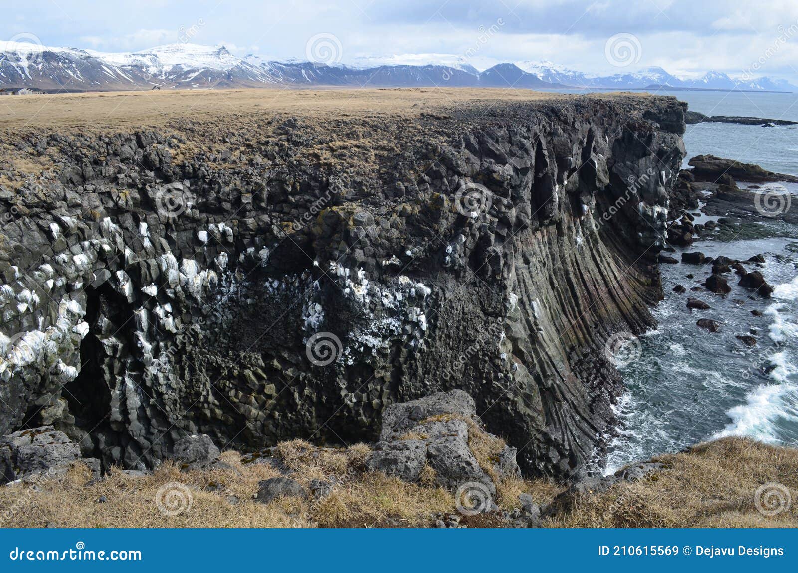 Fantastic View of Rock Cliffs, Basalt Columns and Snow Capped Mountains ...