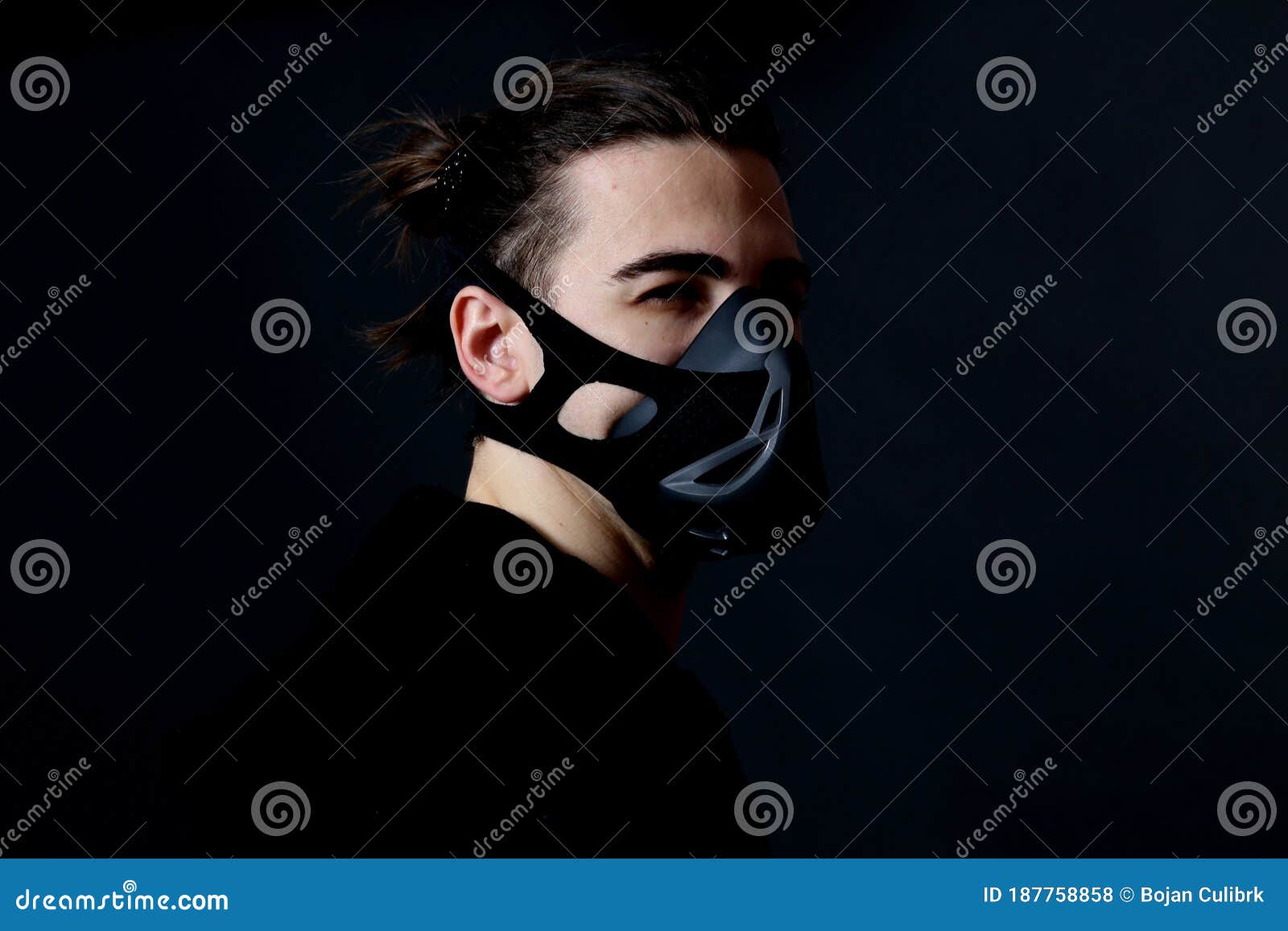 Young Male Model with Mask Posing in Studio. Fantasy, Halloween, Sci-Fi ...