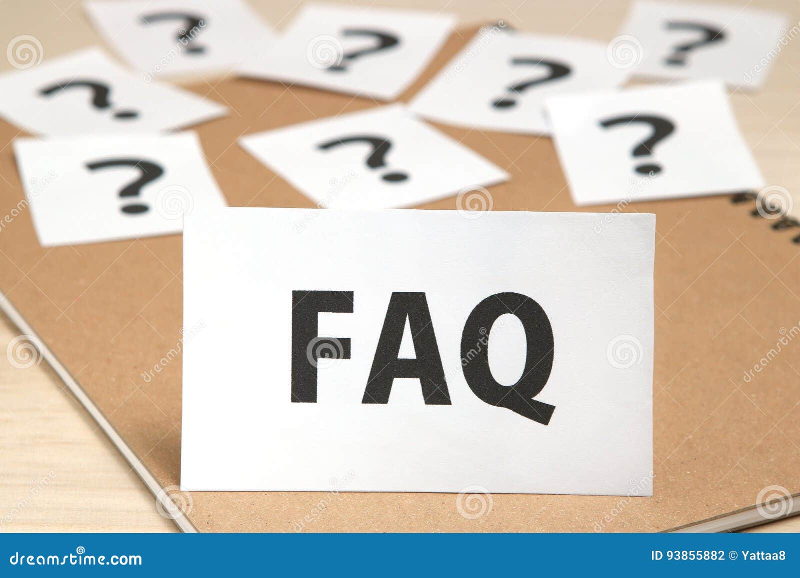 FAQ on a Piece of Paper and Many Question Marks on Notebook. Stock ...
