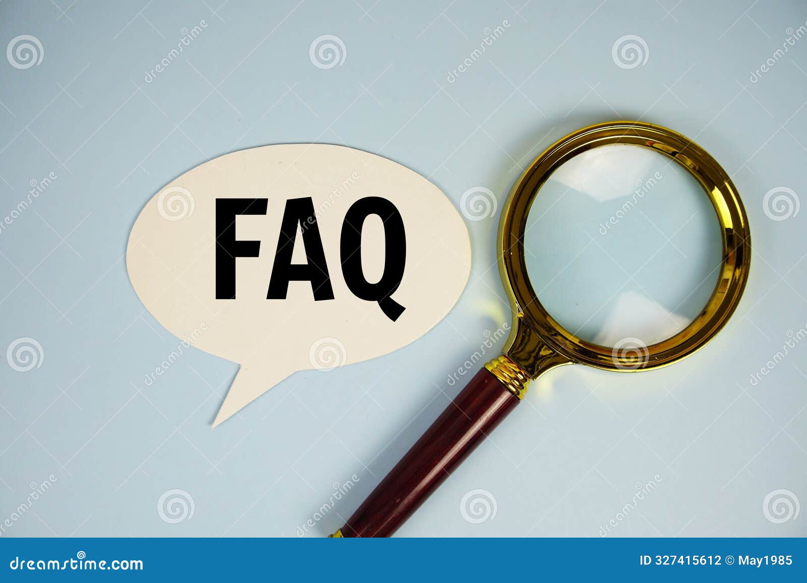 FAQ Text on Speech Bluble with Magnifying Glass Top View on Blue ...