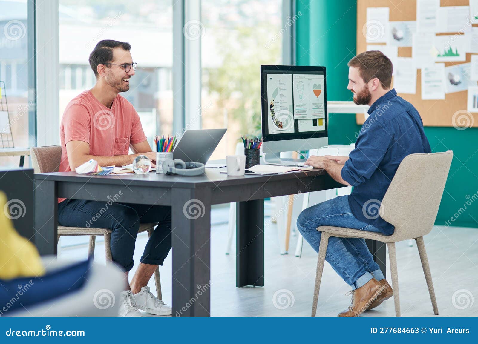 Far from the Days of Uncomfortable Office Cubicles. Two Young ...