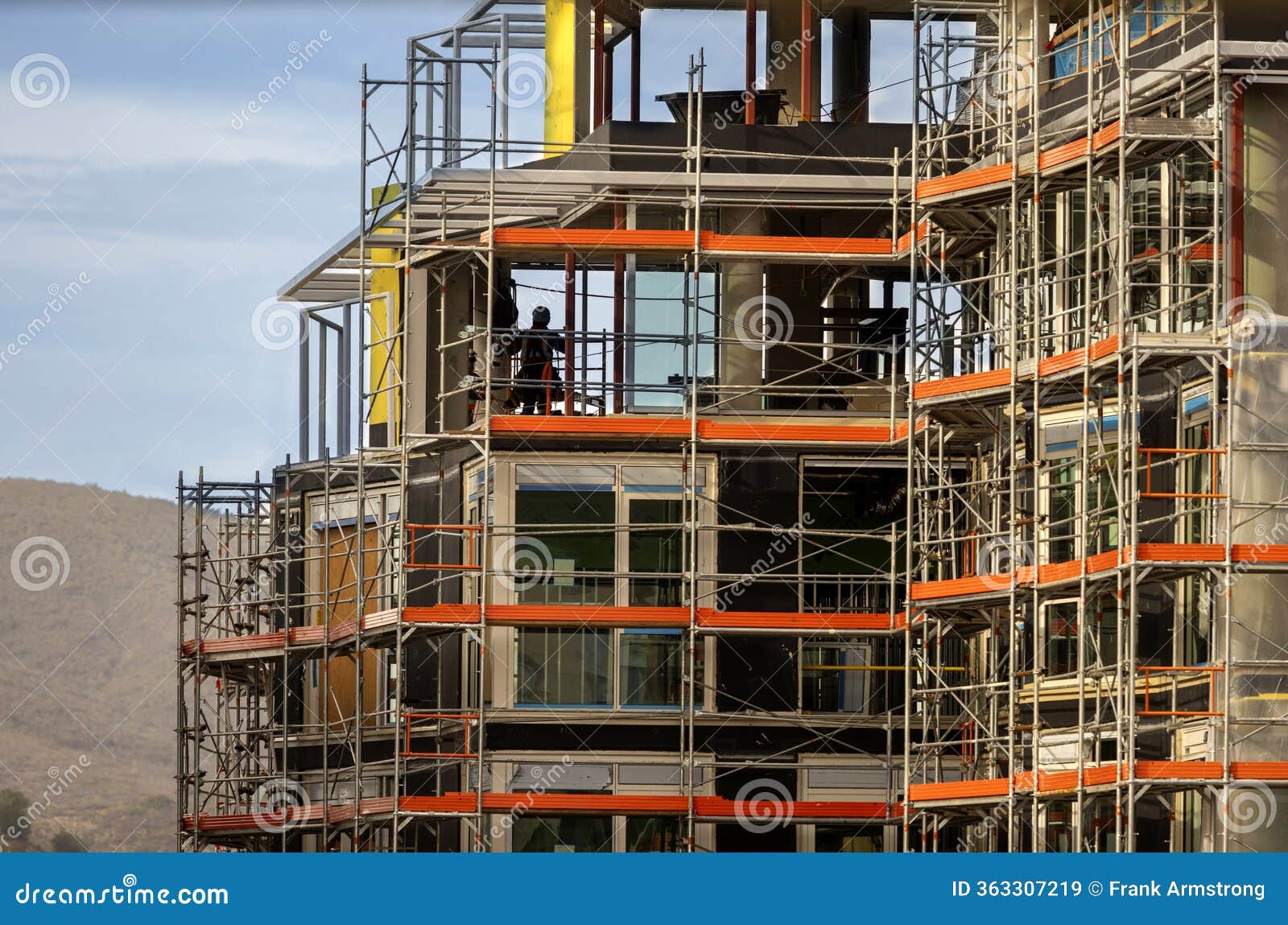 Far Shot of a Construction Worker Working in a Large Commercial ...