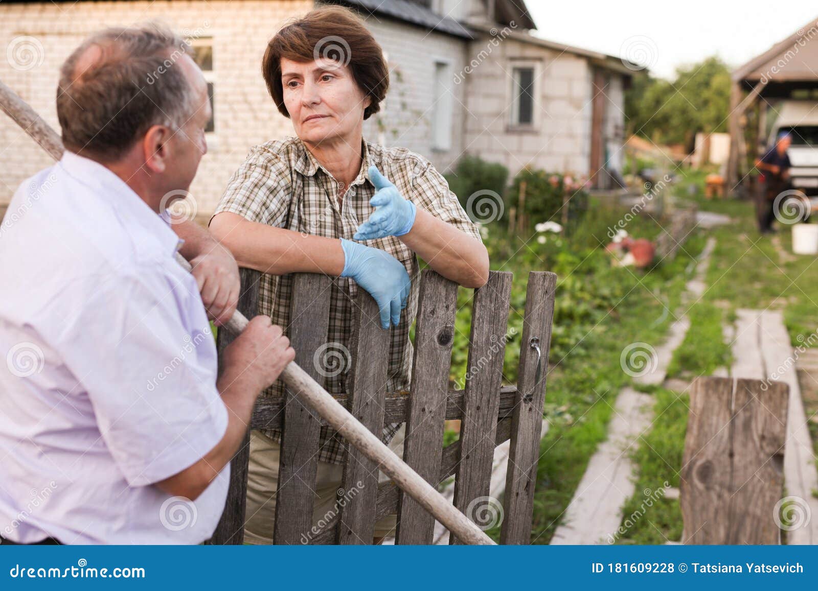 Farm Neighbors Talking at Fence Stock Photo - Image of courtyard, fence ...