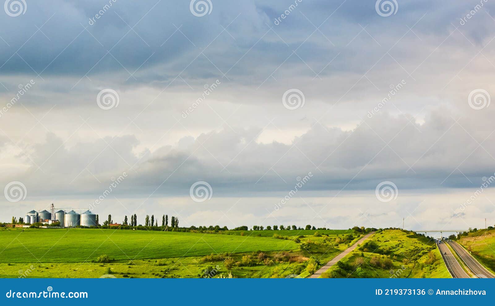Farm Silos at a Distant Farm at Sunset. Stock Photo - Image of farmer ...