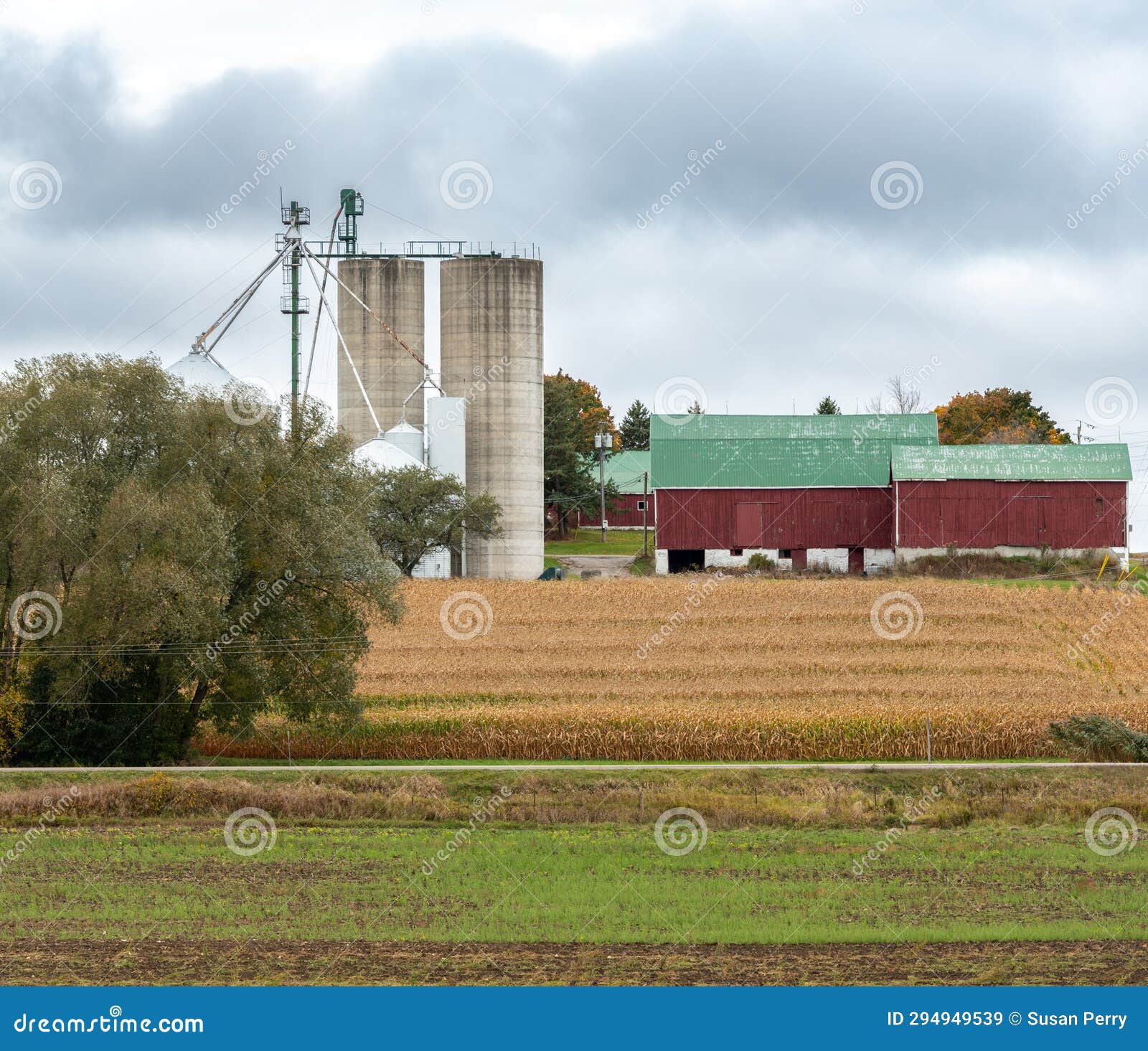 Farm with Silos, Trees and Cloudy Sky Stock Image - Image of silos ...