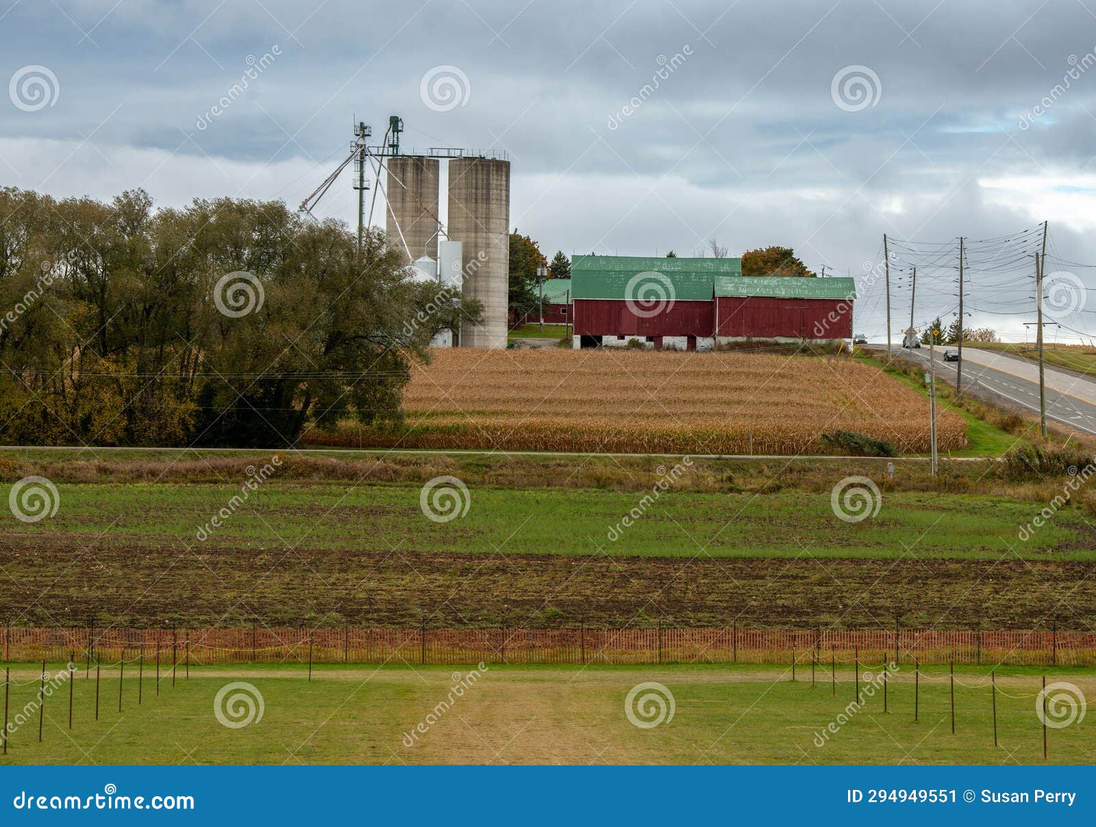 Farm with Silos, Trees and Cloudy Sky Stock Image - Image of lawn ...