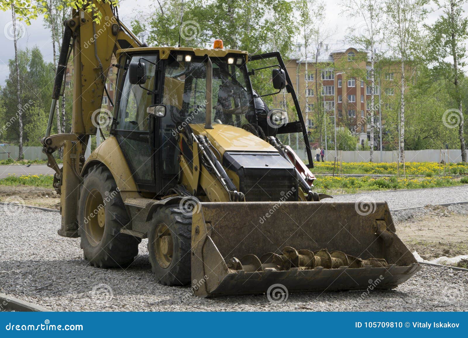 Farm Tractor with Bucket Down and Hay and Straw Inside Stock Photo ...