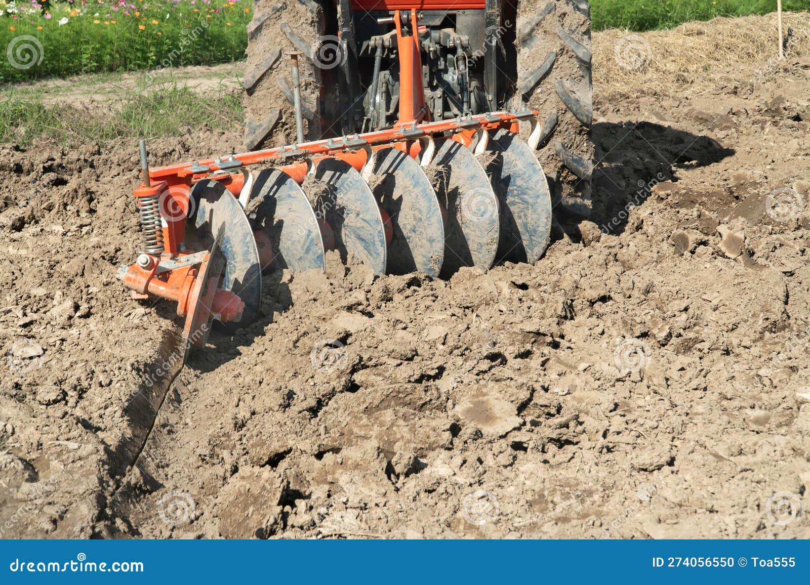 Farm Tractor Cultivating Land with a Plow Stock Photo - Image of ...