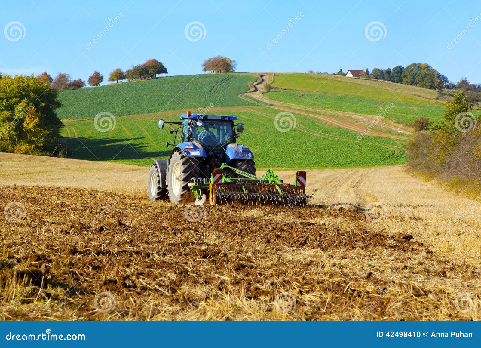 Farm Tractor on the Field Working Stock Photo - Image of crop ...