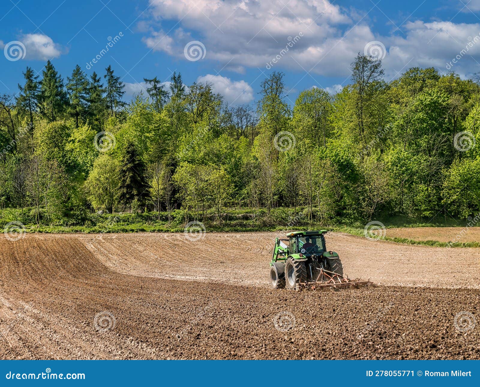 Tractor Harrowing Soil Stock Photography | CartoonDealer.com #165560984