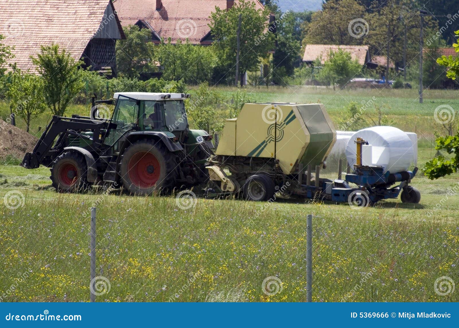 Farm tractor and hay baler stock photo. Image of farm - 5369666