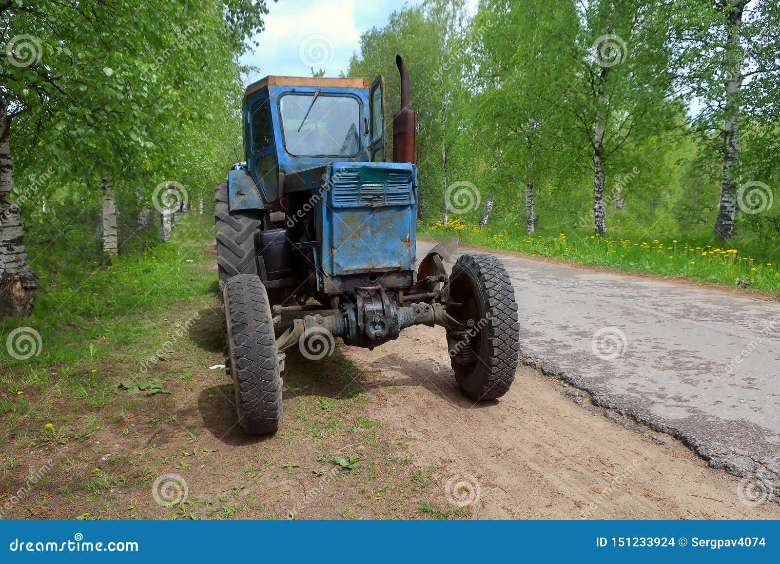 Farm Tractor Parked on the Side of the Road Stock Photo - Image of ...
