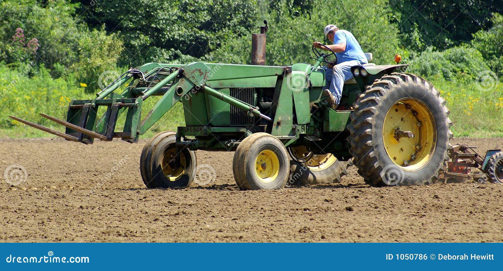 Farm Tractor Plowing editorial photo. Image of farm, agriculture - 1050786