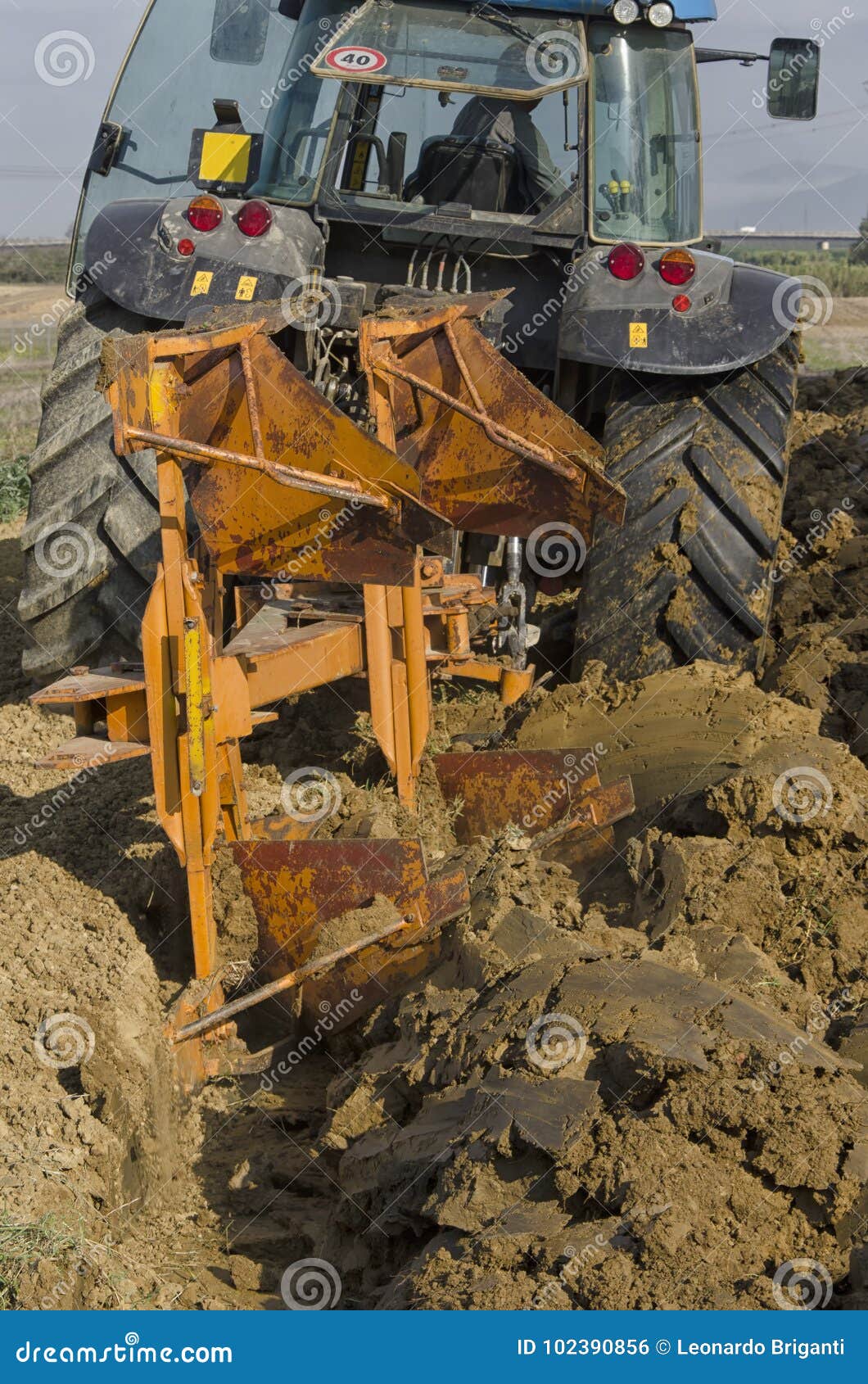 Farm Tractor that Plows the Ground Stock Photo - Image of plough, plots ...