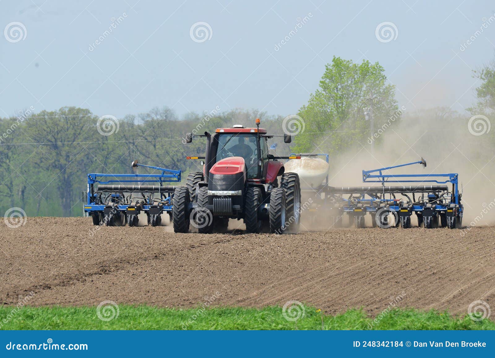 Farm Tractor Pulling a Planter To Seed the Spring Crop Stock Photo ...