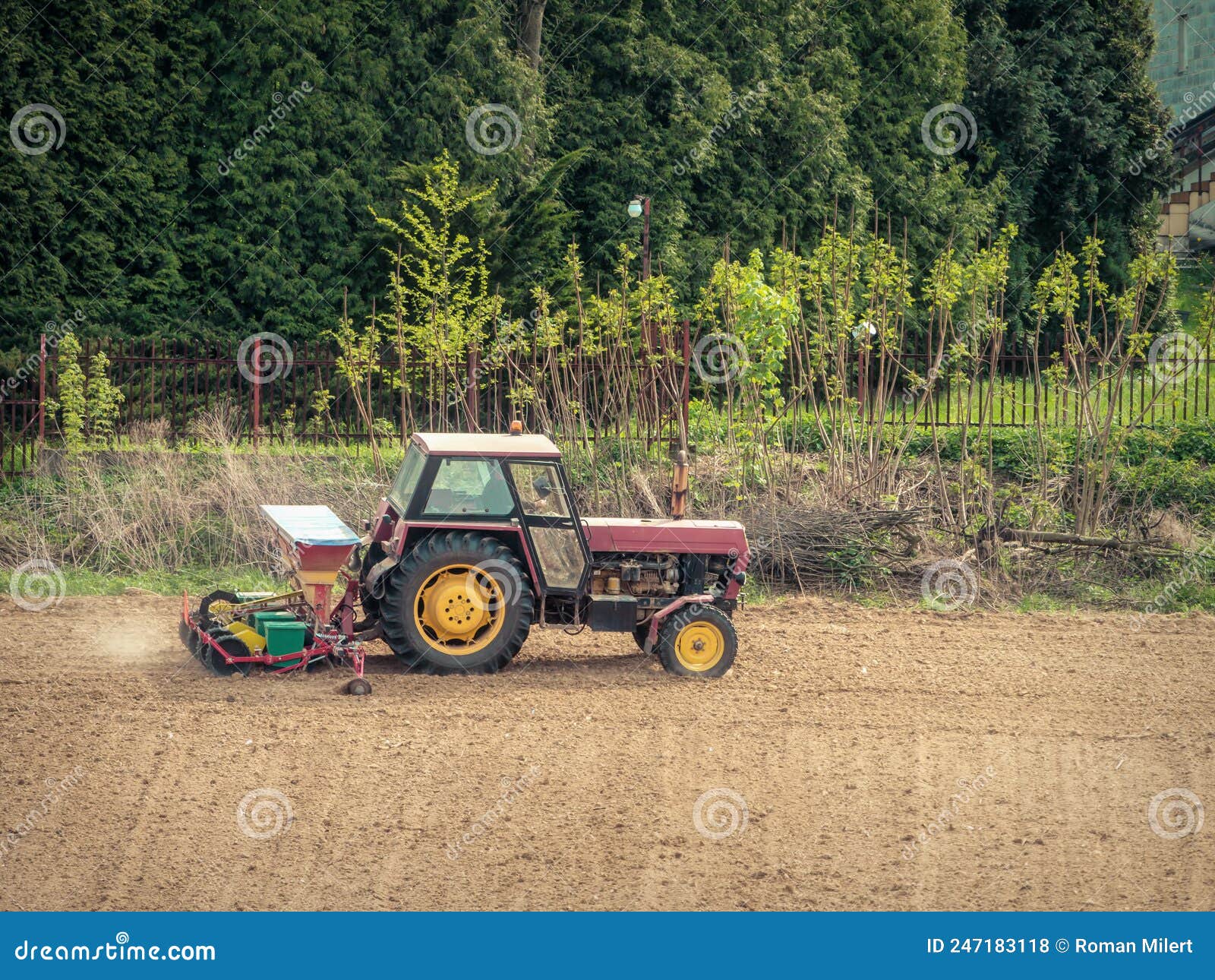 Farm Tractor with Sowing Machine Working in the Arable Field Stock ...
