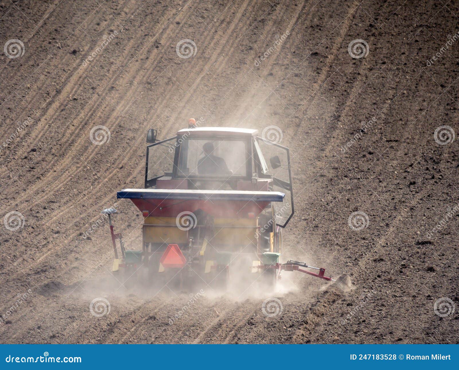 Farm Tractor with Sowing Machine Working in the Arable Field Stock ...