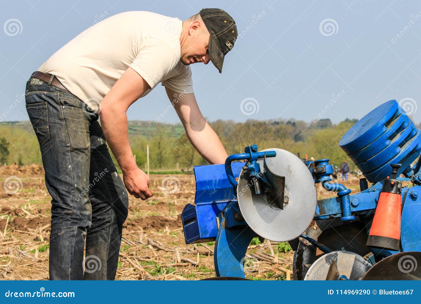 A Farmer Adjusting Plough at Ploughing Match Editorial Image - Image of ...