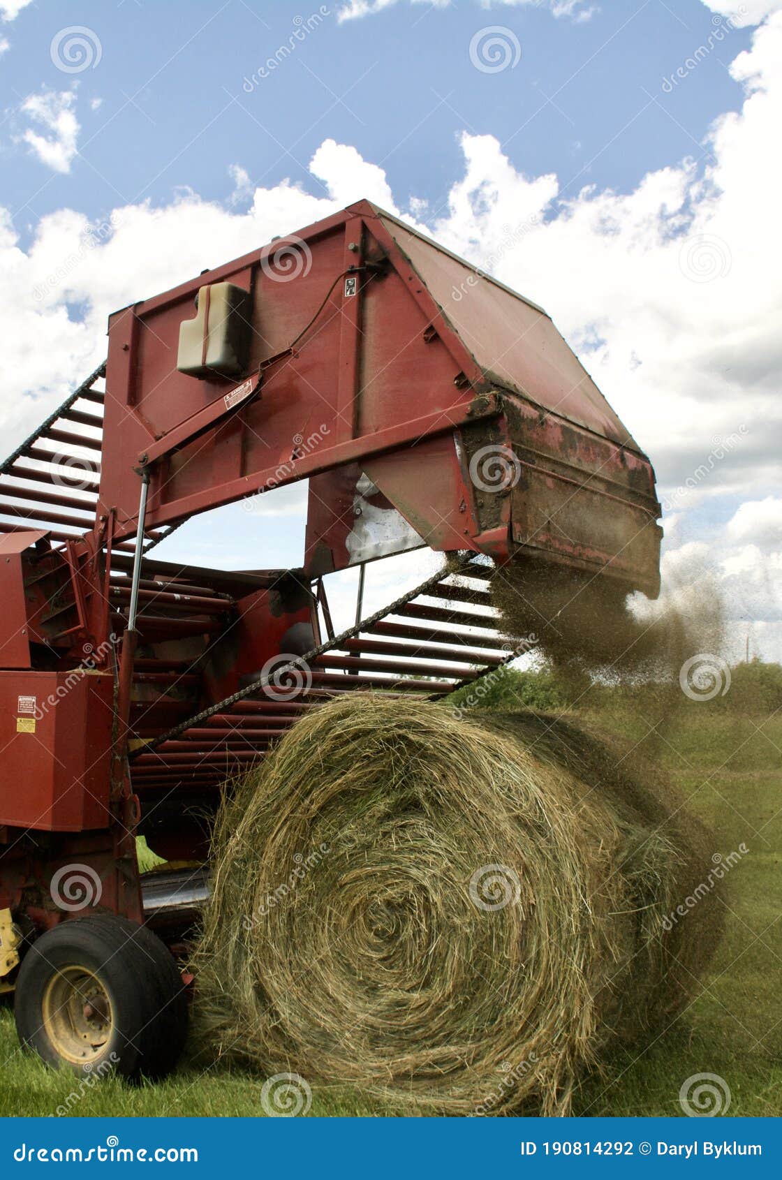 A Farmer Bales Hay in a Lush Minnesota Field. Stock Photo - Image of ...