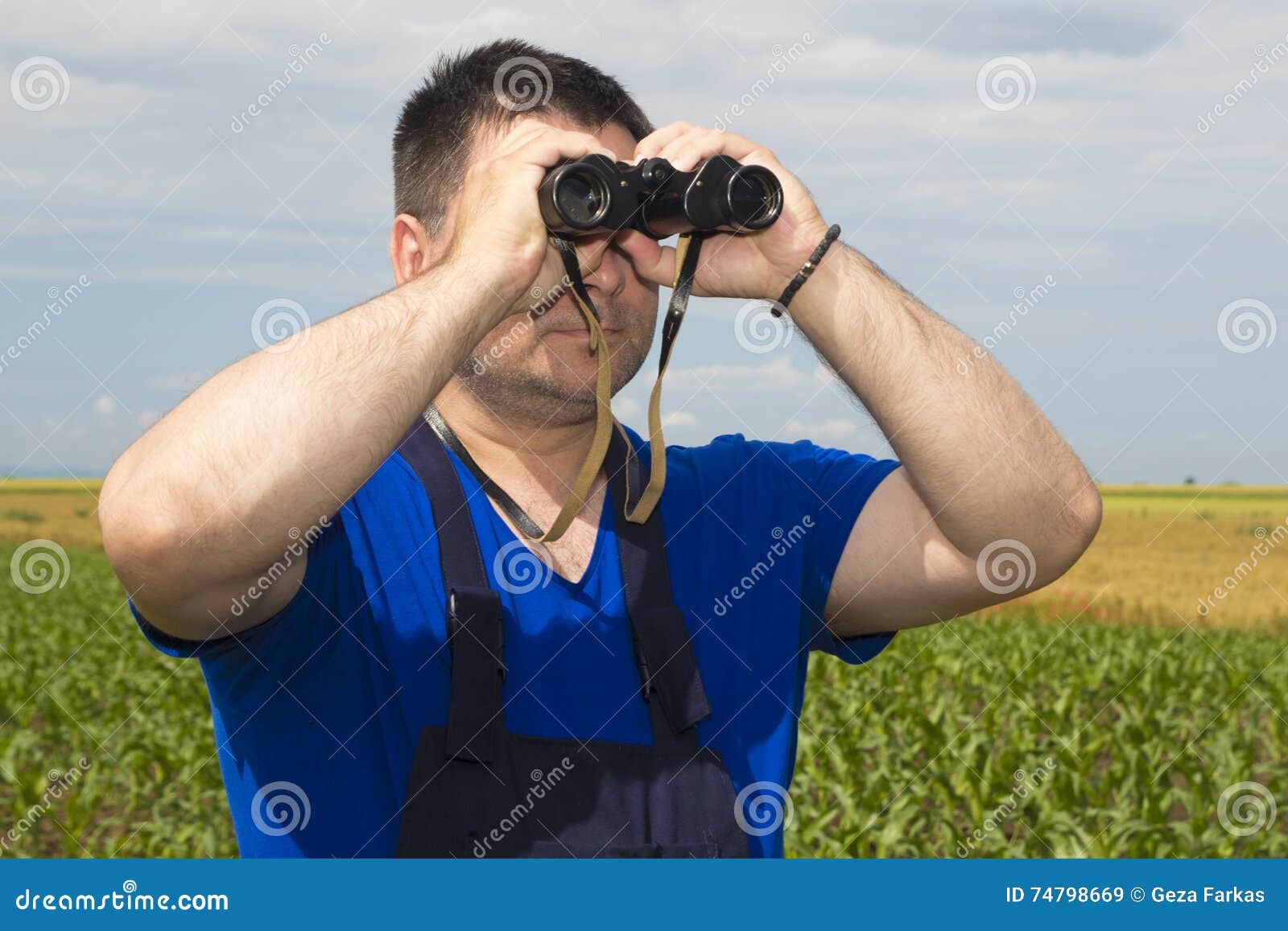 Farmer with Binoculars in the Field Stock Image - Image of cultivation ...
