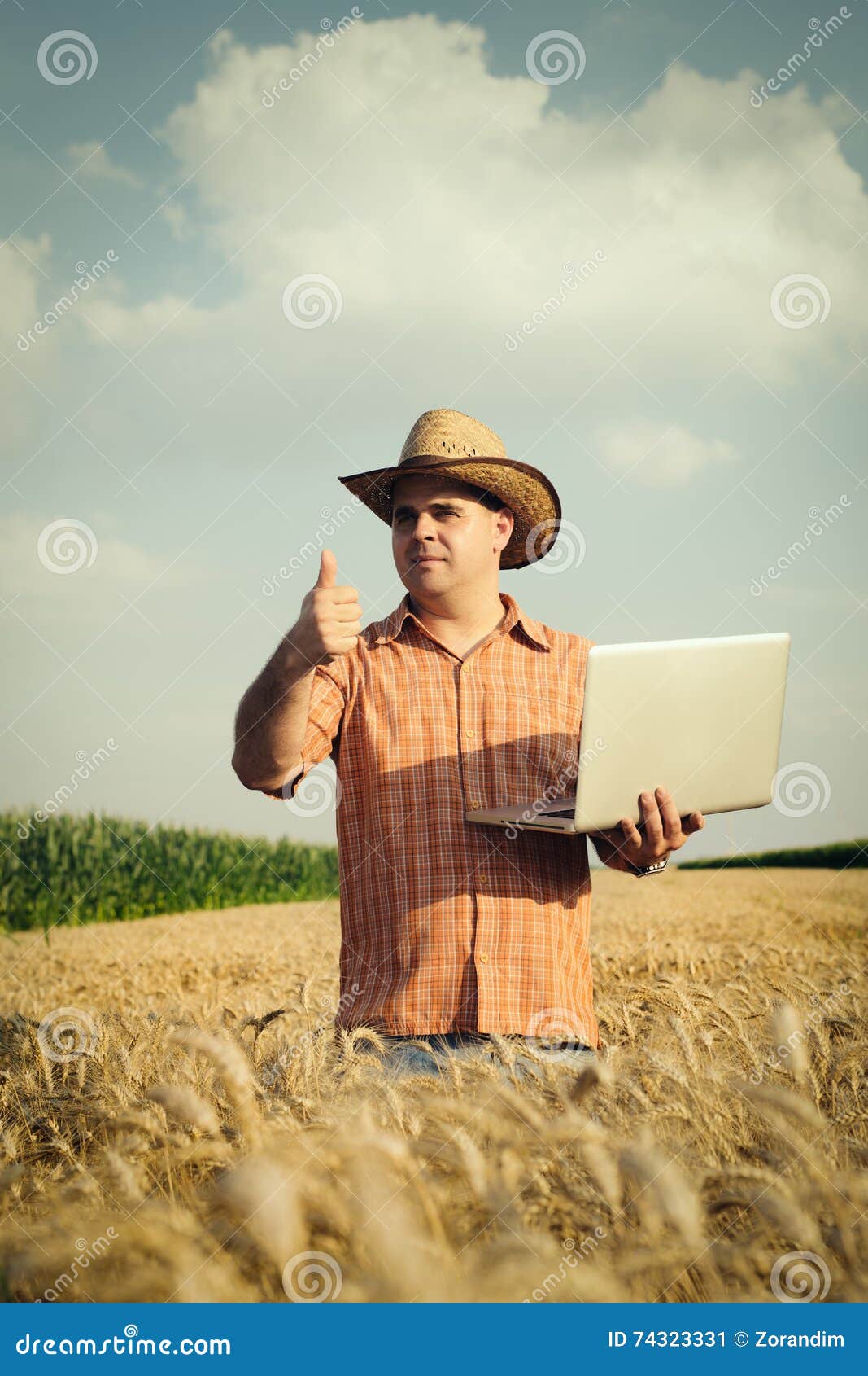 Farmer Checking His Wheat Field Stock Image - Image of computer, farmer ...