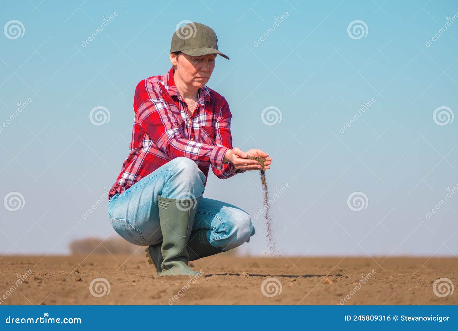 Farmer Checking Soil Quality in Plowed Field Stock Photo - Image of ...