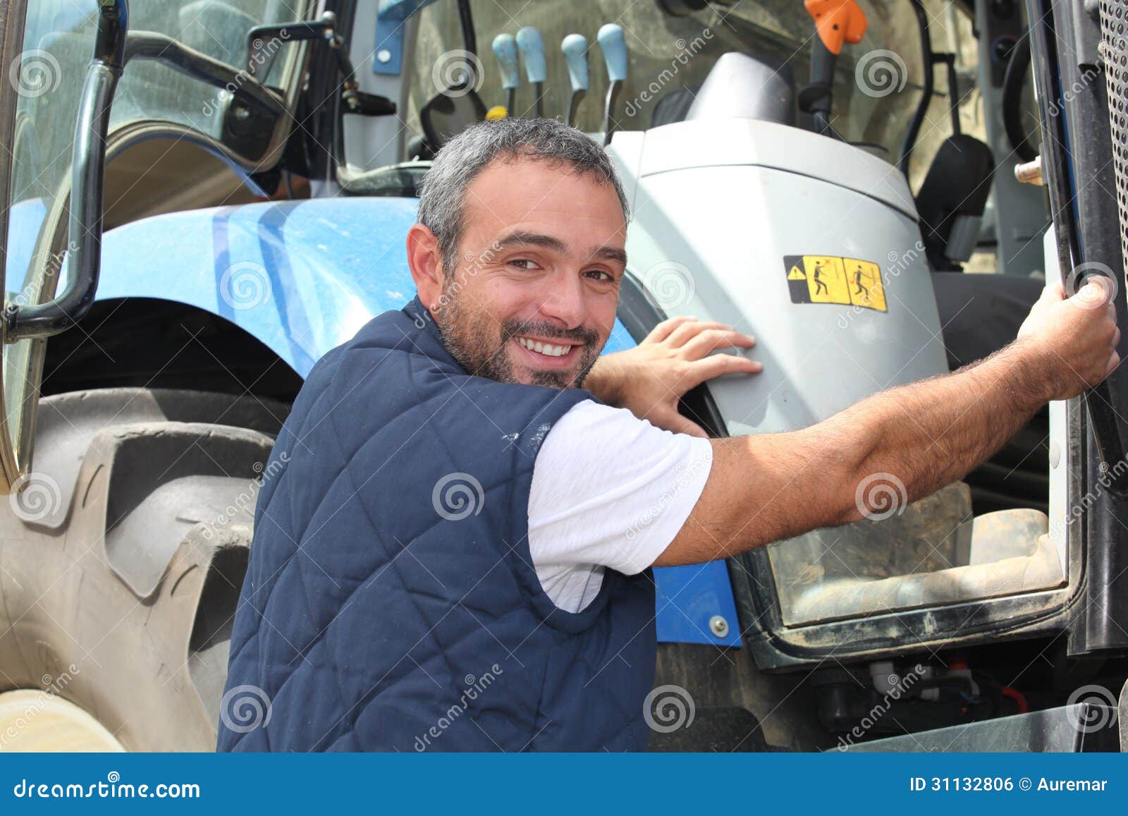 Farmer Climbing into Tractor Stock Photo - Image of cereals, crop: 31132806