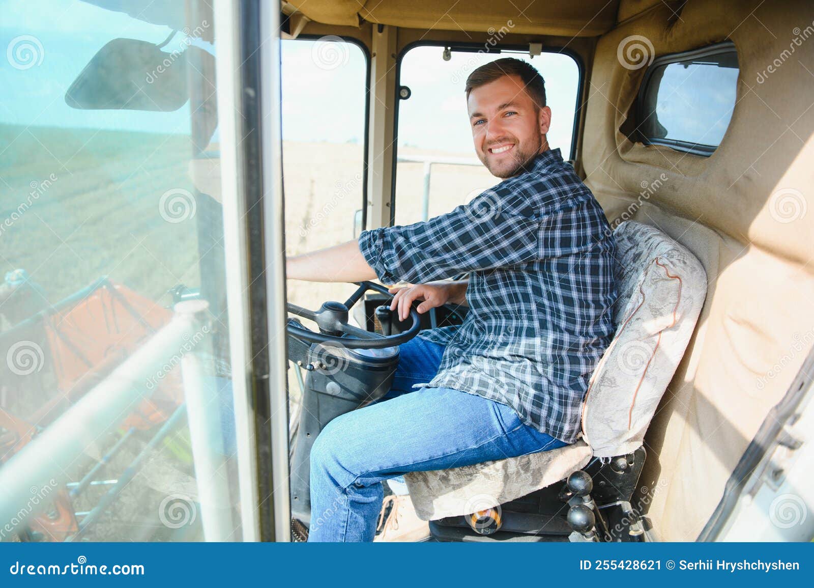 Farmer Controls the Combine Harvester. Stock Image - Image of harvest ...