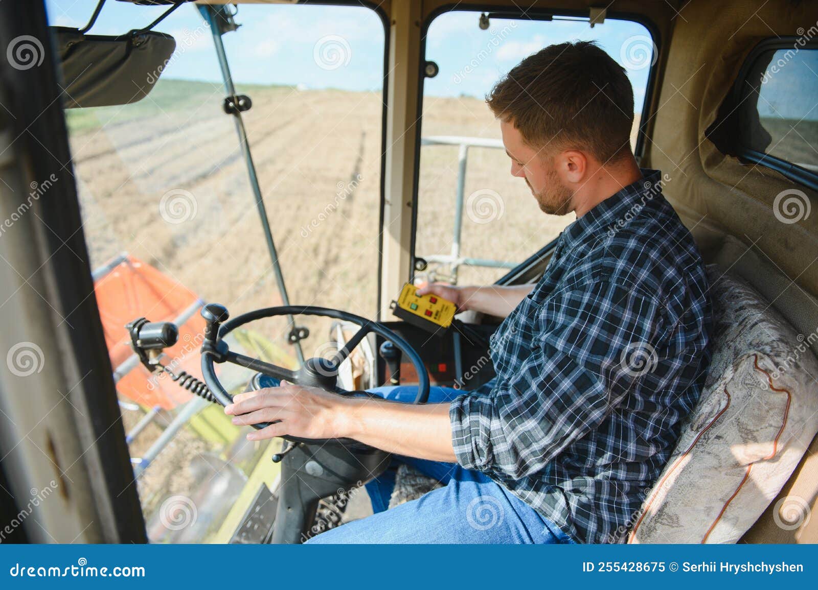 Farmer Controls the Combine Harvester. Stock Image - Image of harvester ...