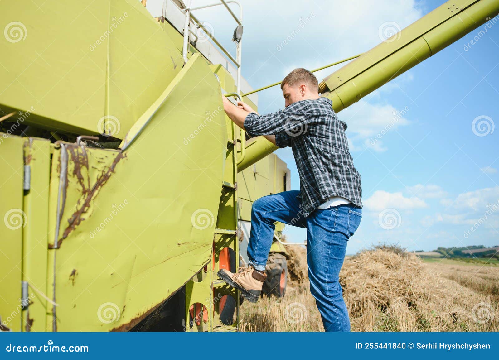 Farmer Controls the Combine Harvester. Stock Photo - Image of combine ...