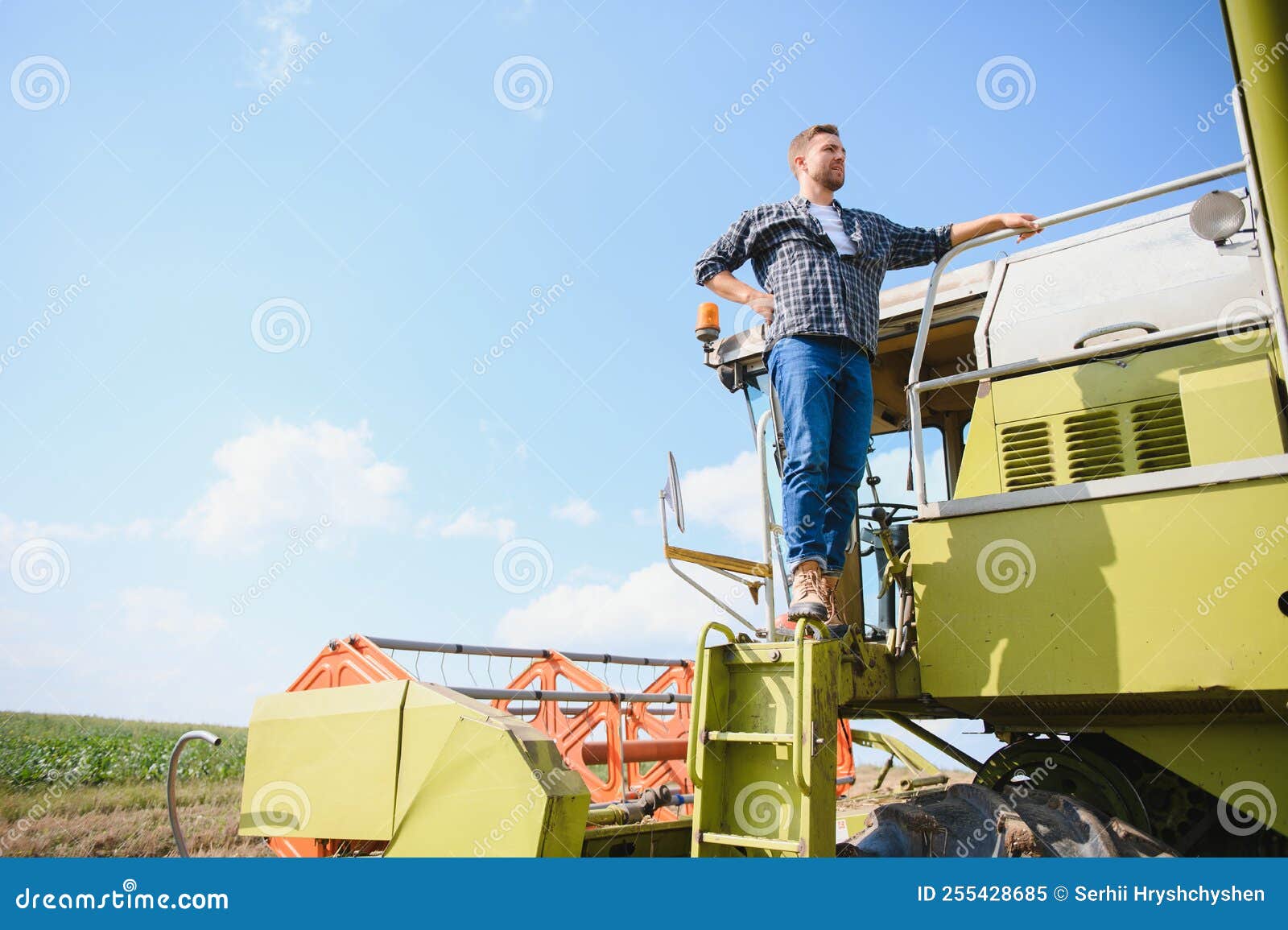 Farmer Controls the Combine Harvester. Stock Image - Image of ...