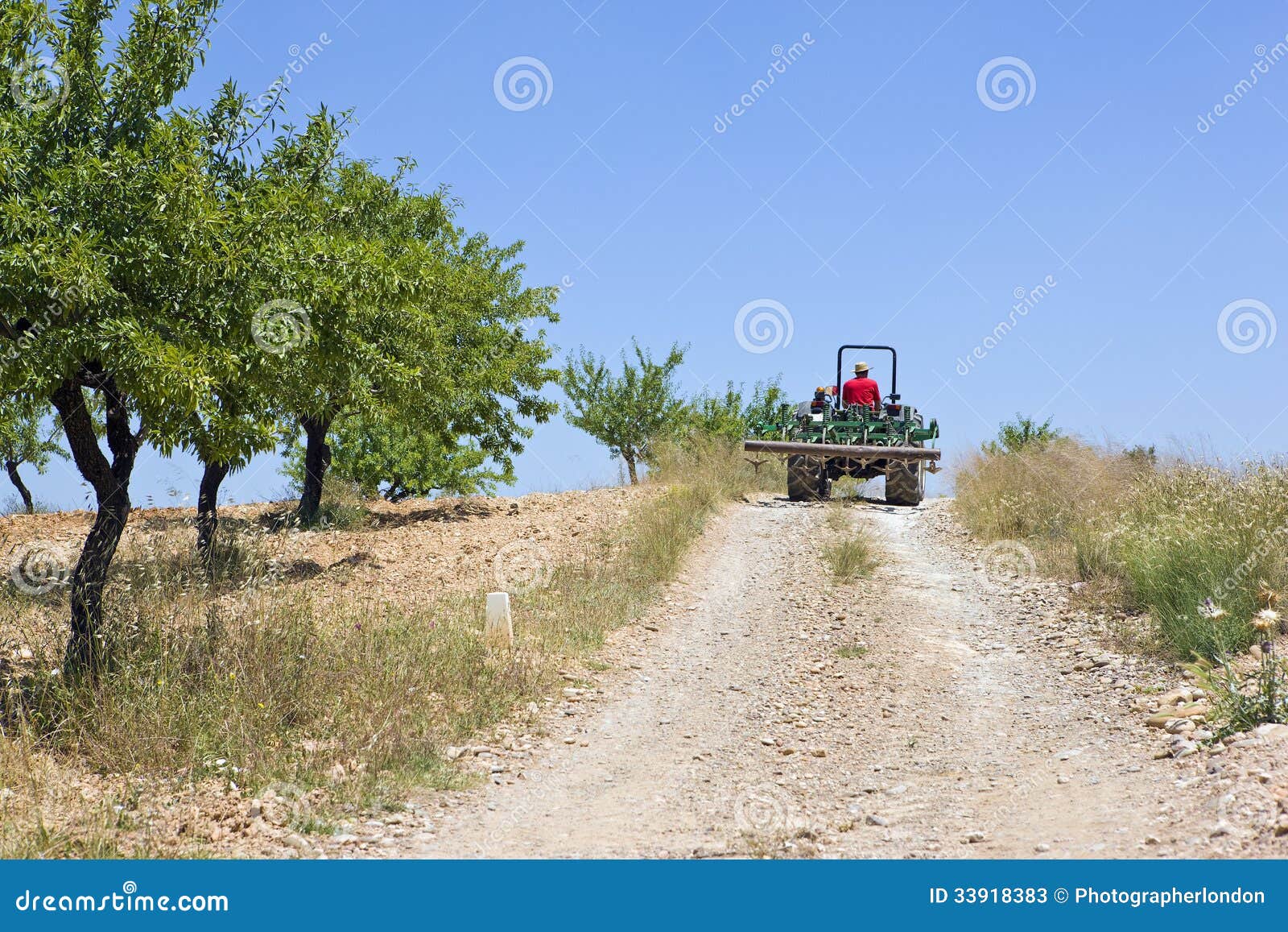 Farmer Driving Tractor on Hillside Stock Image - Image of horizontal ...
