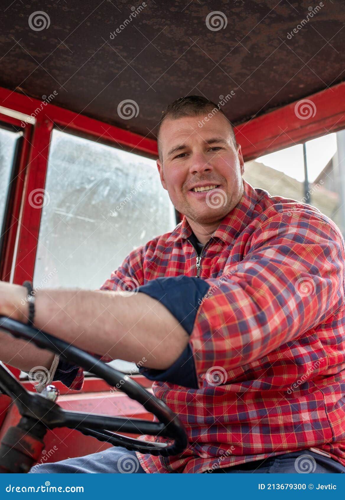 Farmer driving tractor stock photo. Image of working - 213679300