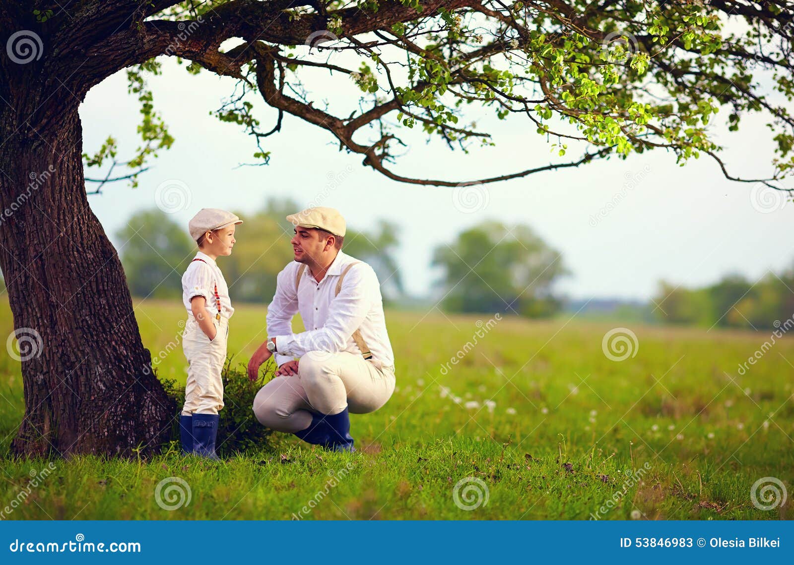 Farmer Family Having Fun Under an Old Tree, Spring Countryside Stock ...