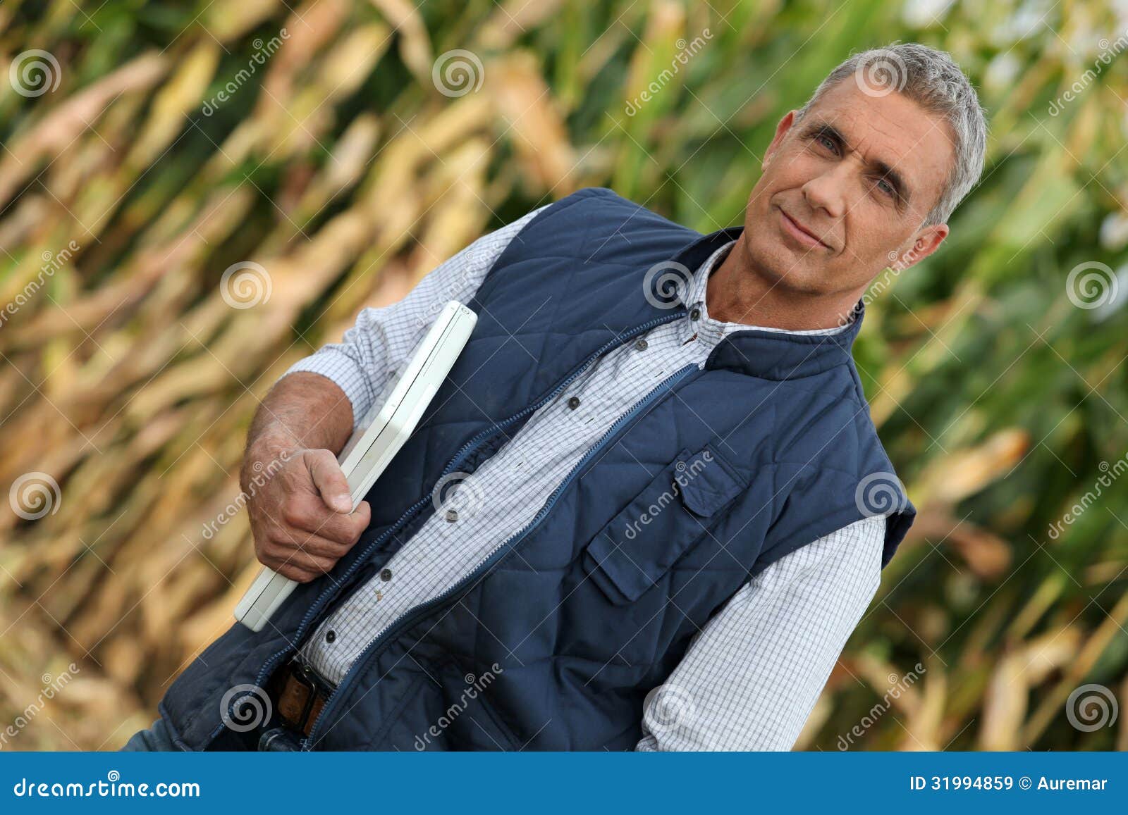 Farmer in his field stock image. Image of laptop, farm - 31994859
