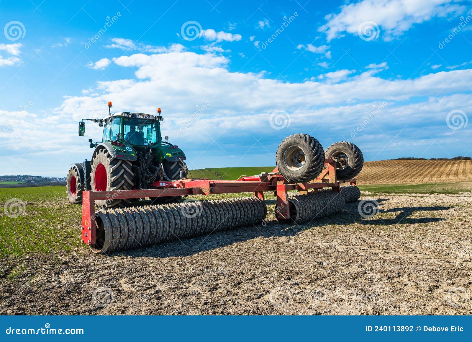 Farmer and His Tractor Equip with a Compaction Roller To Refine the ...
