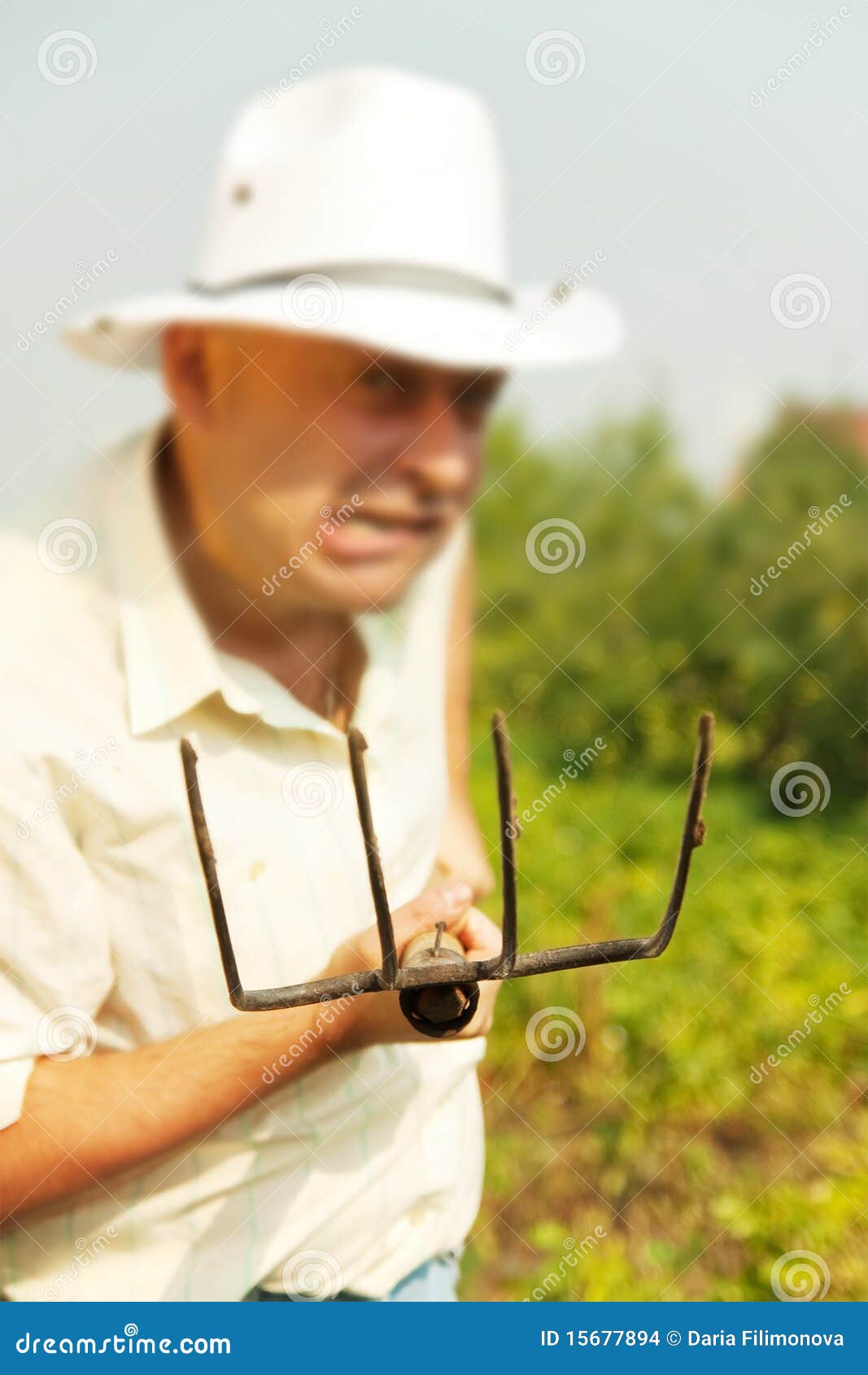 Farmer holding pitchfork stock photo. Image of angry - 15677894