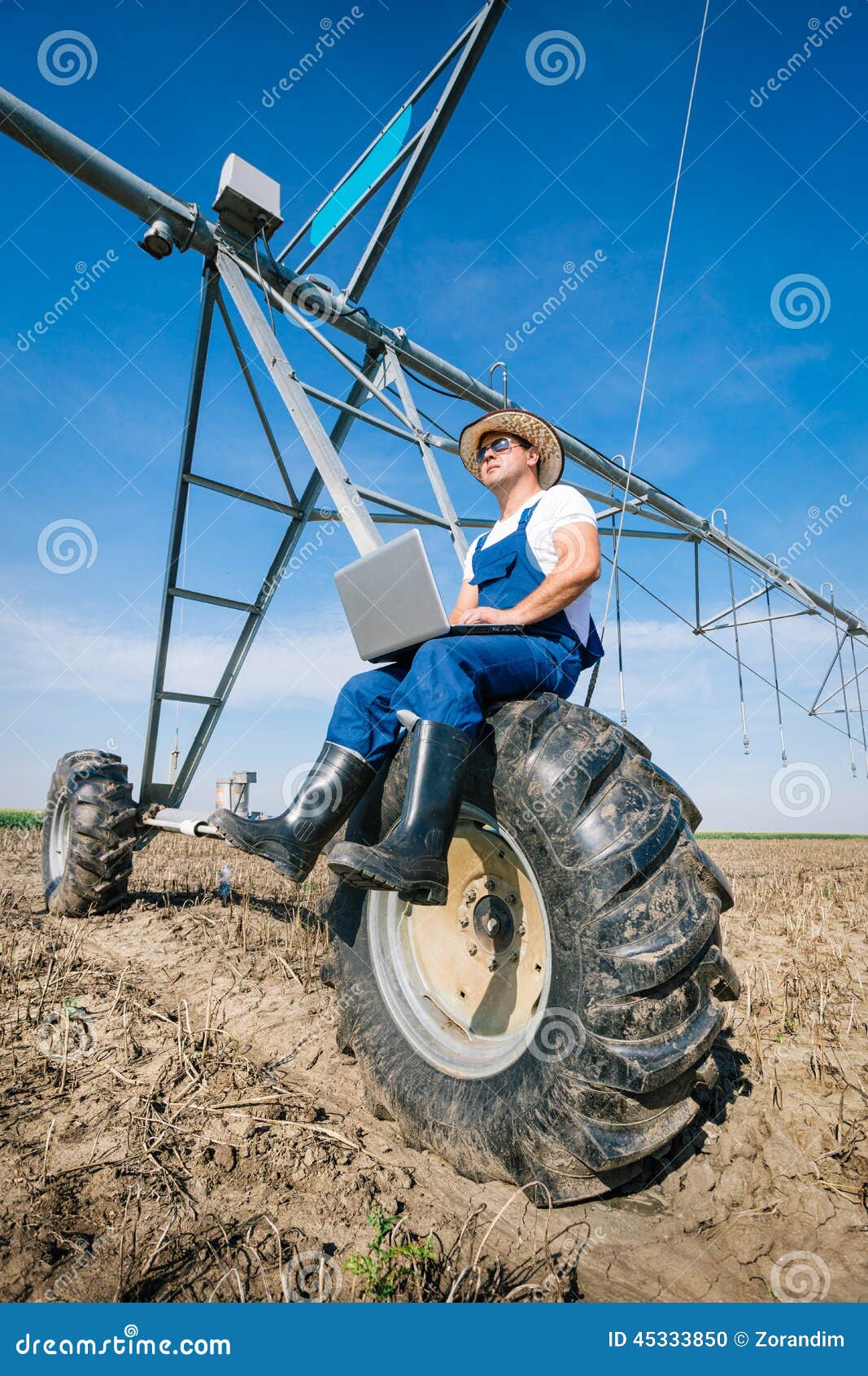 Farmer on Irrigation Systems Stock Photo - Image of irrigation, crop ...