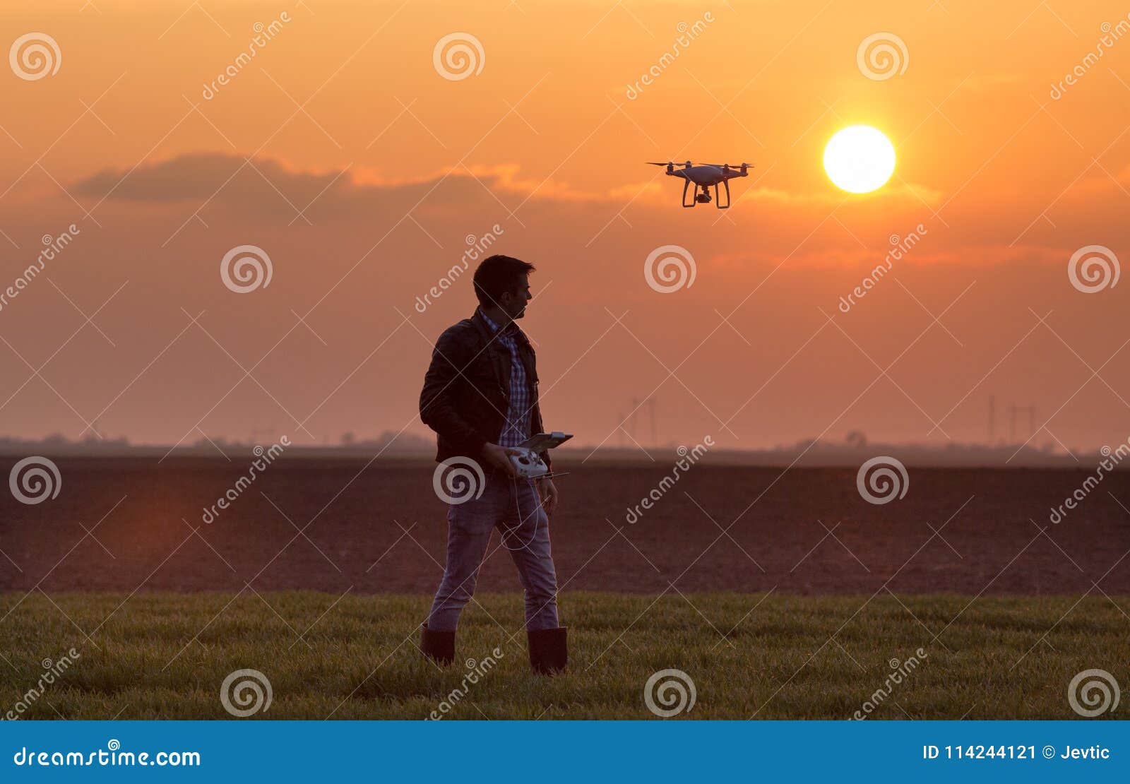 Farmer Navigating Drone Above Farmland Stock Image - Image of farmer ... Farmer Navigating Drone Above Farmland Stock Image - Image of farmer ...