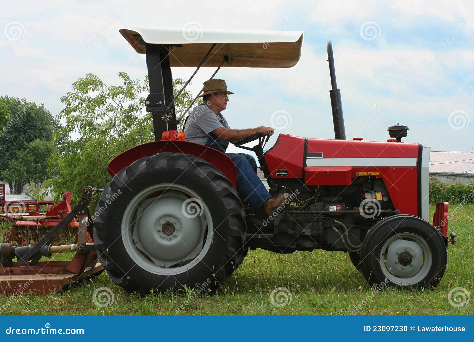 Farmer Operating Tractor stock photo. Image of equipment - 23097230
