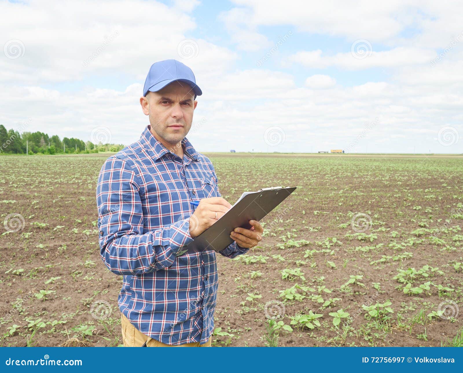 Farmer in Plaid Shirt Controlled His Field and Writing Notes Stock ...