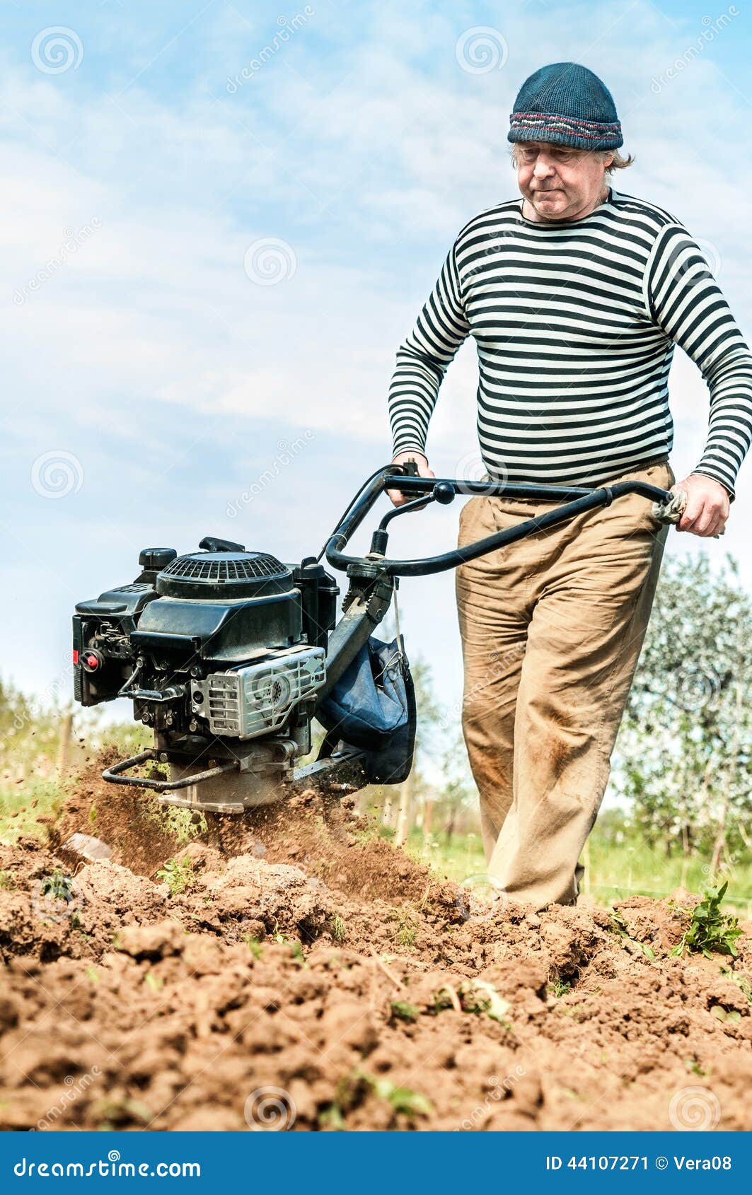 Farmer plowing the field. stock image. Image of growing - 44107271