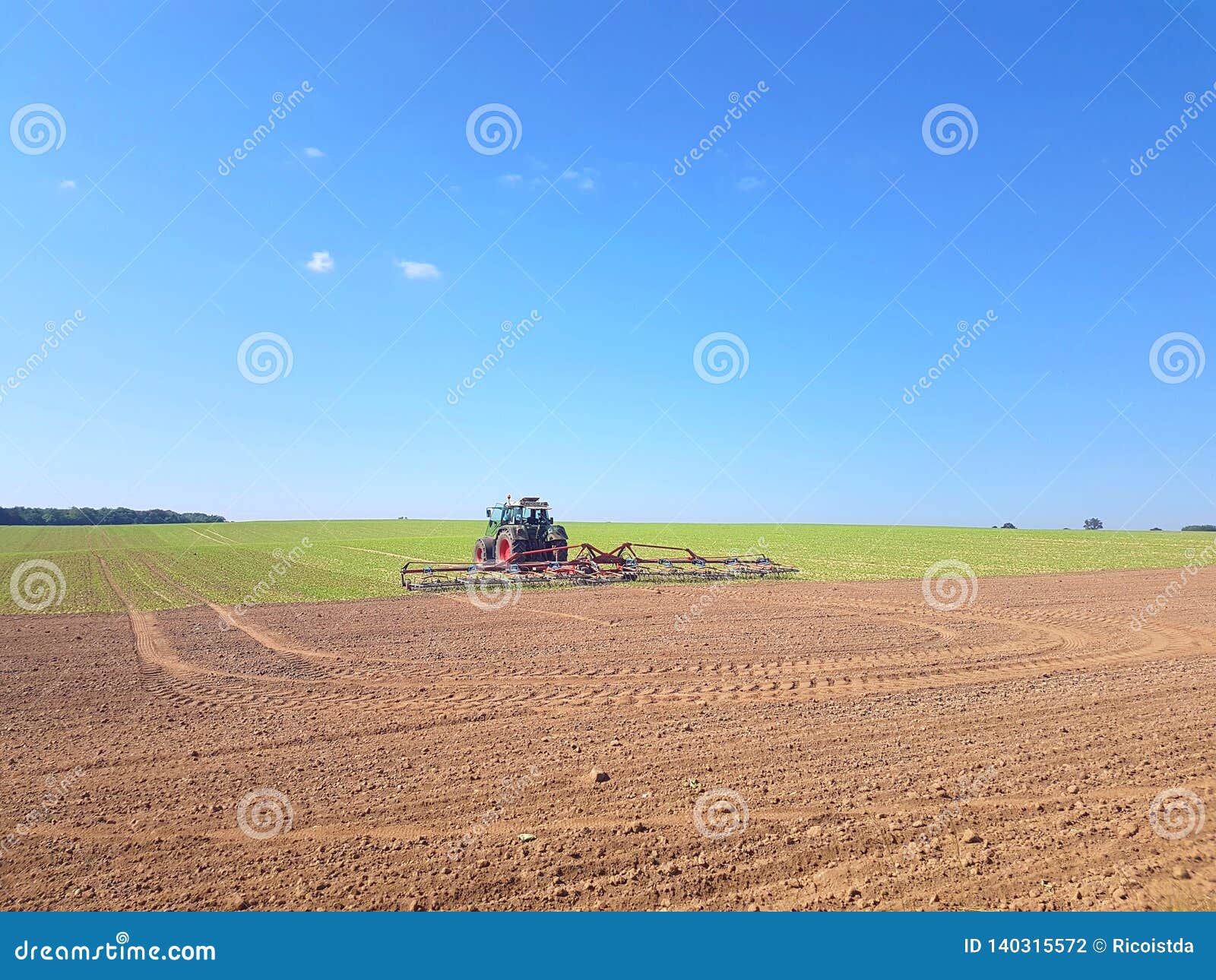 Farmer is Plowing a Field with Tractor Stock Photo - Image of ...