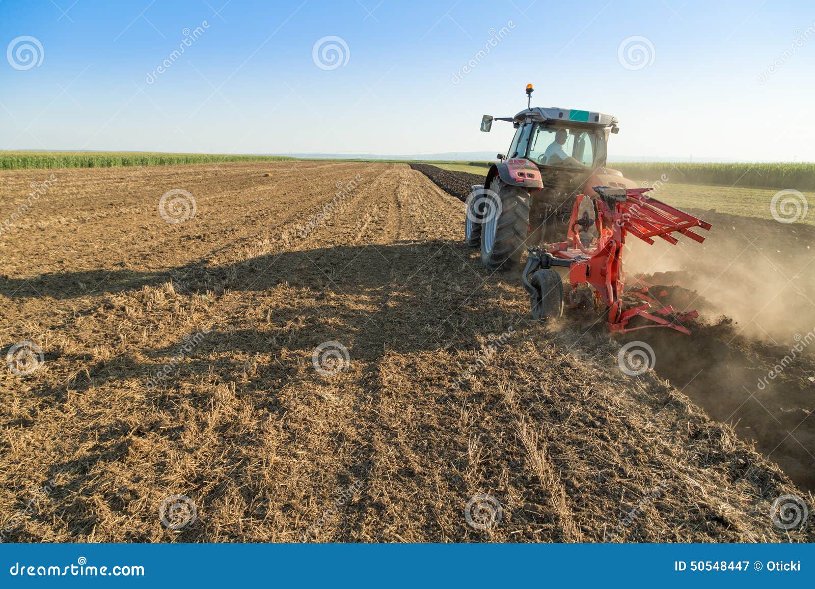 Farmer Plowing Stubble Field with Red Tractor Stock Image - Image of ...
