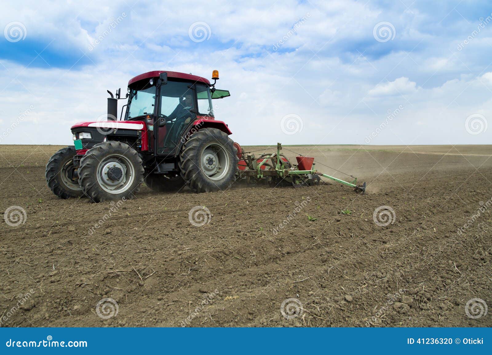 Farmer Seeding Corn Crops at Field with Pneumatic Seeder. Stock Photo ...