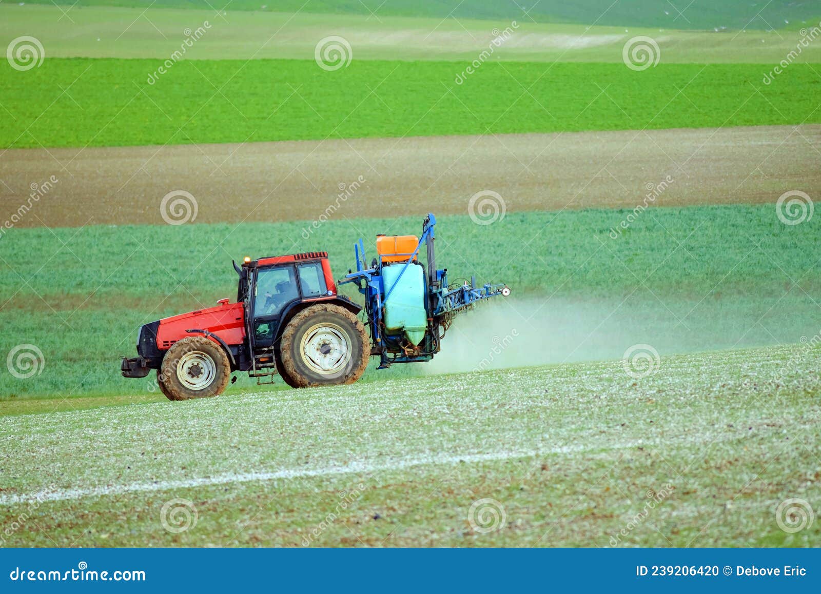 Farmer Spraying His Fields for Fertilizer or Pesticides Stock Photo ...